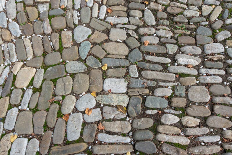 The Road is Made of Smooth Stones. Cobblestone Texture Stock Photo ...