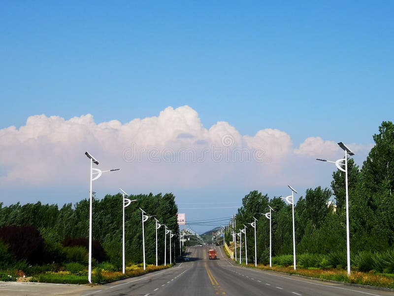A Road with Many Post Under the White Clouds Stock Image - Image of ...