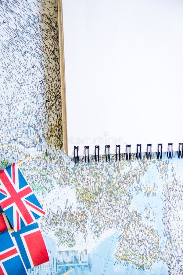 Road Map ,open Notebook, National Flags on Wooden Table. Vacation Plan ...