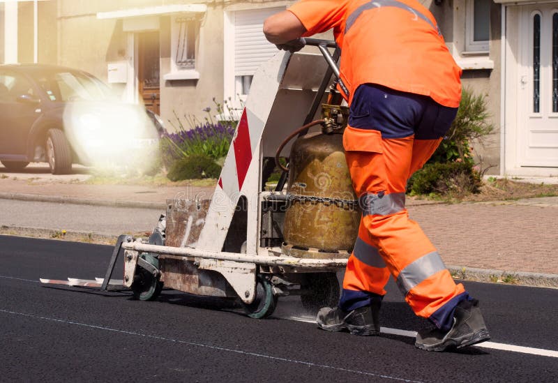 Road Marking Applicator Working on the White Lines in the Middle of a ...