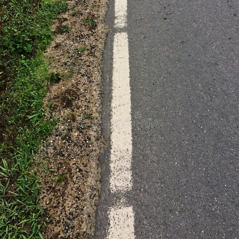Road Marking Near the Roadside Stock Image - Image of plant, asphalt ...