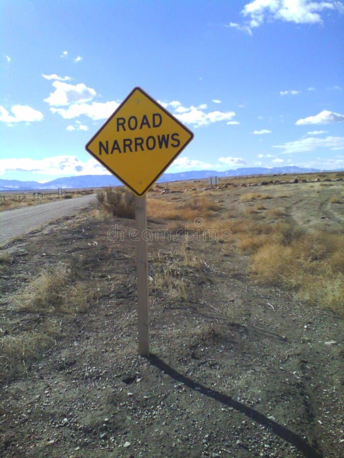 Road Narrows and New Road Layout Signs Stock Photo - Image of post ...