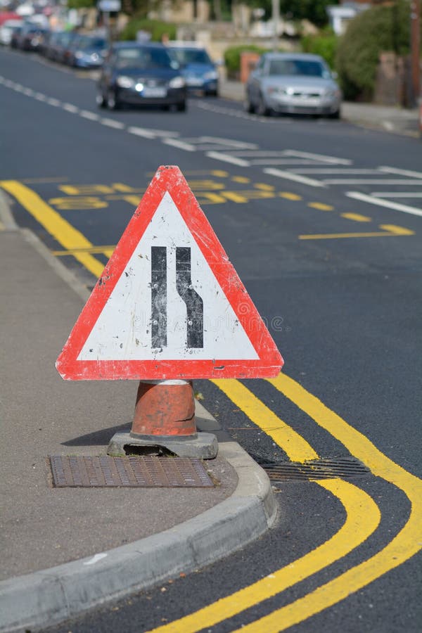 Road Narrows and New Road Layout Signs Stock Photo - Image of post ...