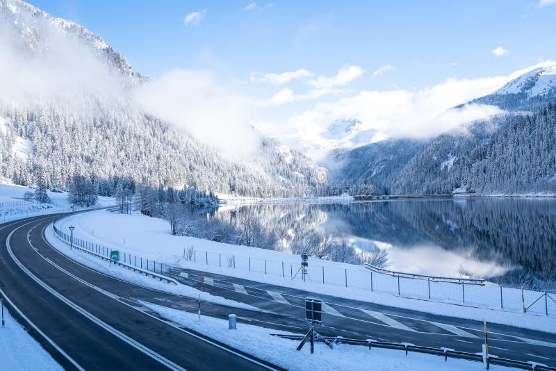 Road Near the Lake in the Mountainous Forest in the Alps Stock Image ...