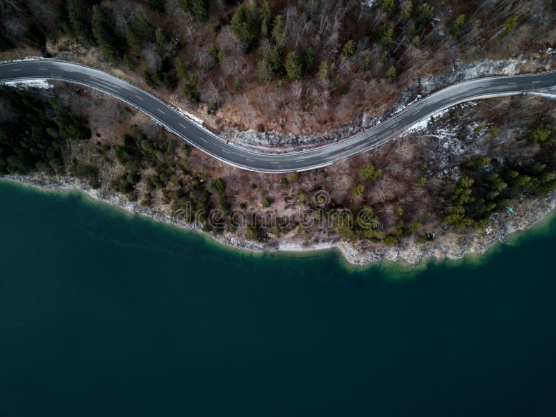 Road Next To a Lake through Forest Stock Photo - Image of lake, curves ...