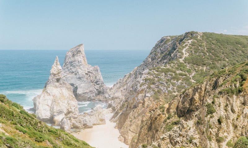 Road Next To a Stunning Beach and Awe-inspiring Cliffs Overlooking the ...