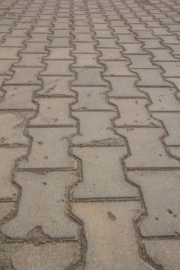 The Road is Paved with Cracked Paving Slabs Stock Photo - Image of ...