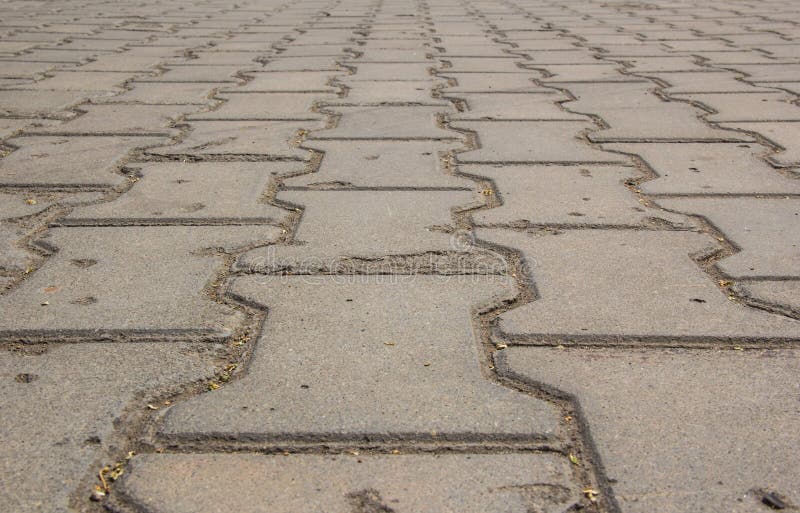 The Road is Paved with Cracked Paving Slabs Stock Photo - Image of ...
