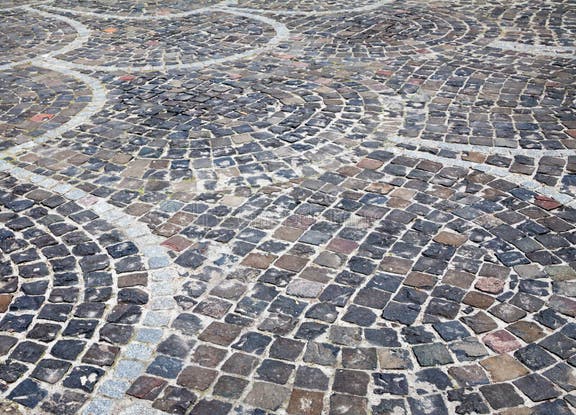 Road paved with gray setts stock photo. Image of paving - 149331704