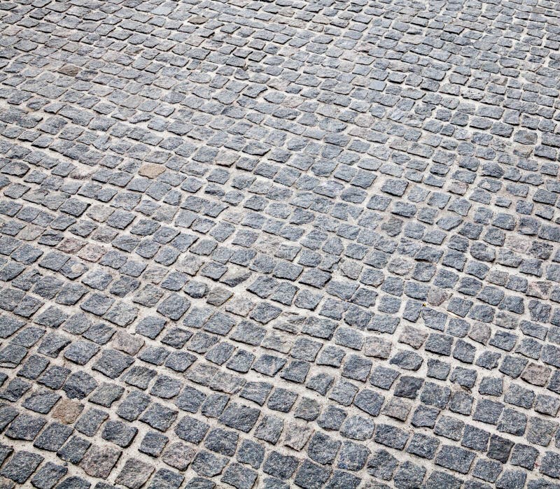 Road paved with gray setts stock photo. Image of block - 149332172