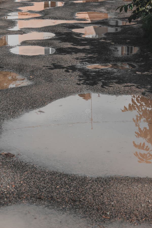 Road with Pits after the Rain. Stock Image - Image of bumpy, pothole ...