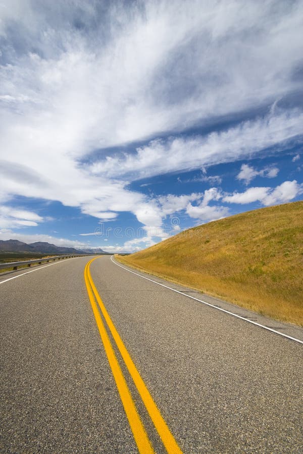 Image of a Wide Open Prairie and Mountains with a Paved Highway Road ...