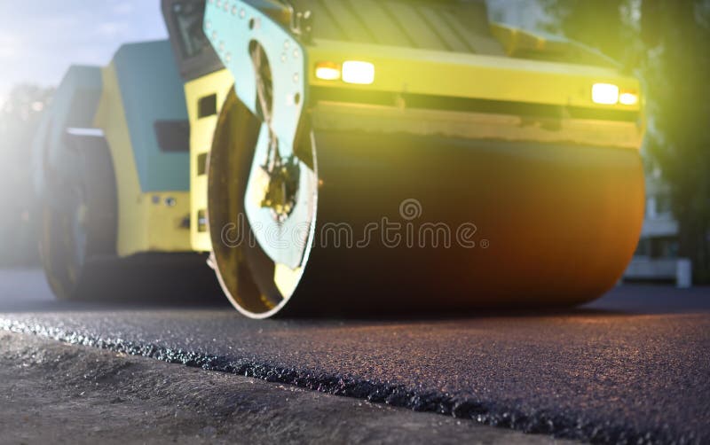 Road Repair, Thin Layer of New Asphalt Close-up and Road Roller Stock ...