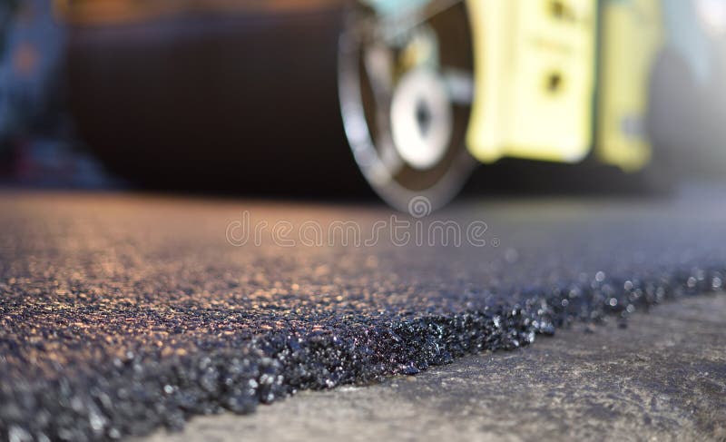 Road Repair, Thin Layer of New Asphalt Close-up and Road Roller Stock ...