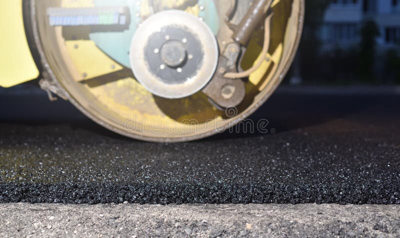 Road Repair, Thin Layer of New Asphalt Close-up and Road Roller Stock ...