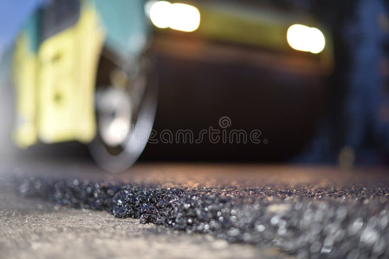 Road Repair, Thin Layer of New Asphalt Close-up and Road Roller Stock ...