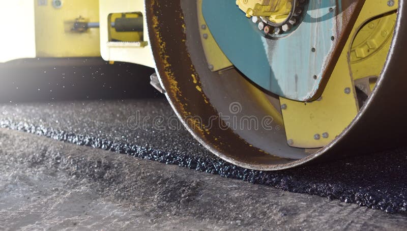 Road Repair, Thin Layer of New Asphalt Close-up and Road Roller Stock ...