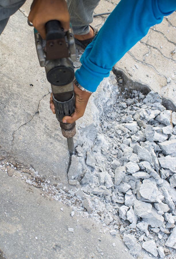 Road Repairing Works with Jackhammer. Male Worker Using Jackhammer ...
