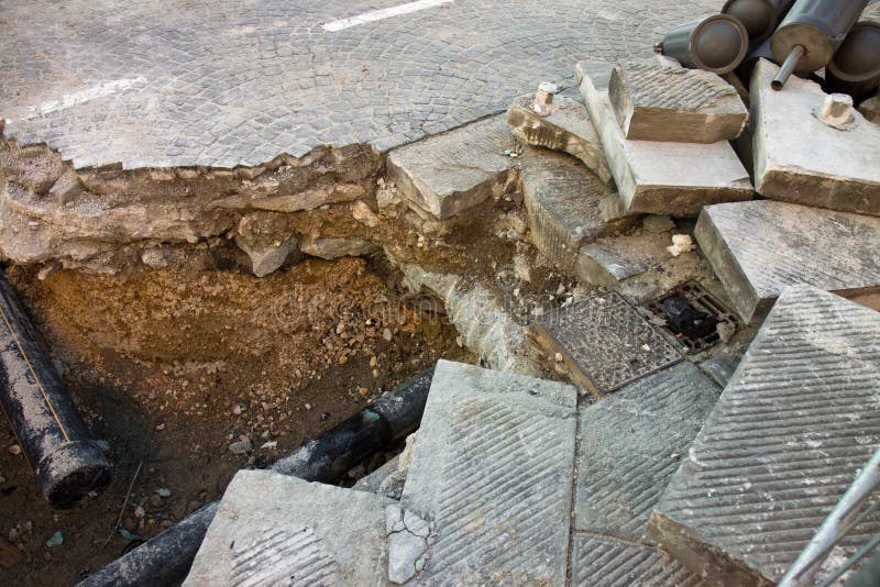 Road Repairs in a Stone Road Stock Photo - Image of street, implants ...
