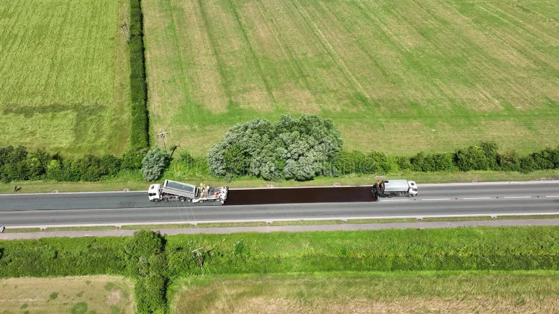 Road Resurfacing Using Micro Asphalt Surface Dressing Stock Video ...