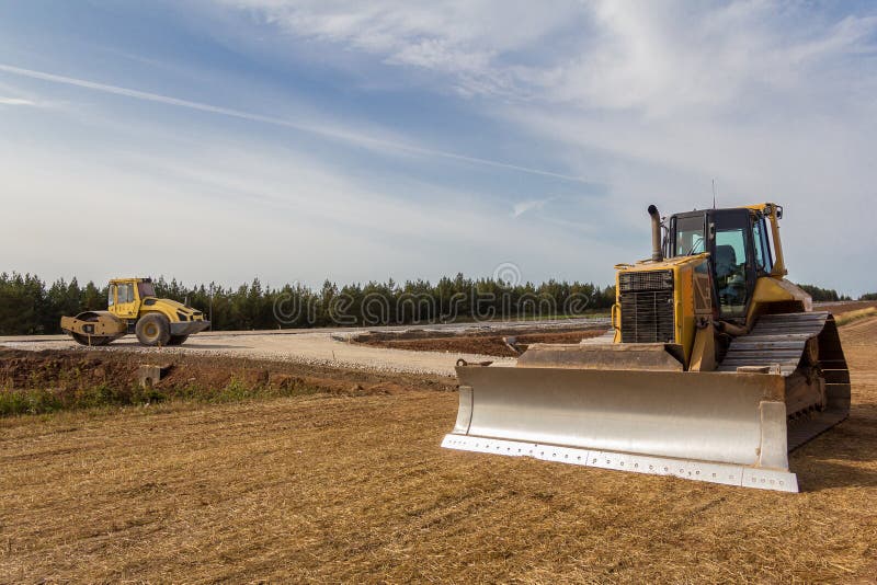 Road Roller and Bulldozer on the Construction of a New Road ...