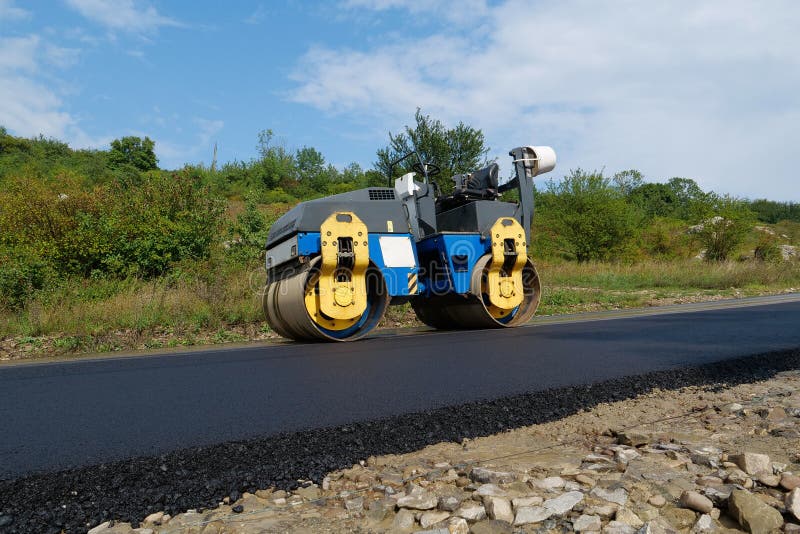 Road Roller Compacted Asphalt on New Road, Completed a Work Stock Image ...