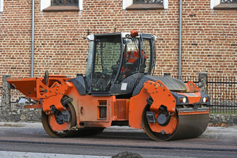 A Road Roller Compacting Asphalt during Operation. Stock Photo - Image ...