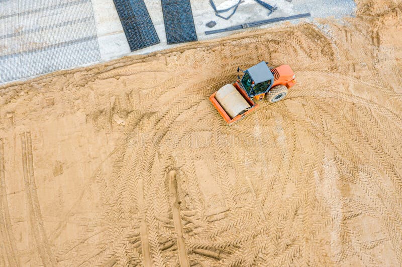 Road Roller at Construction Site. Leveling Sand before Road ...