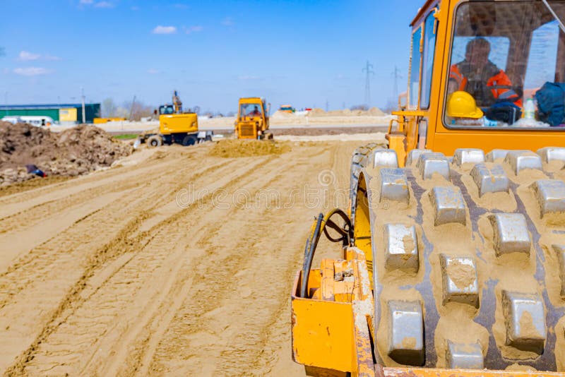 Road Roller with Spikes is Working at Construction Site Stock Image ...