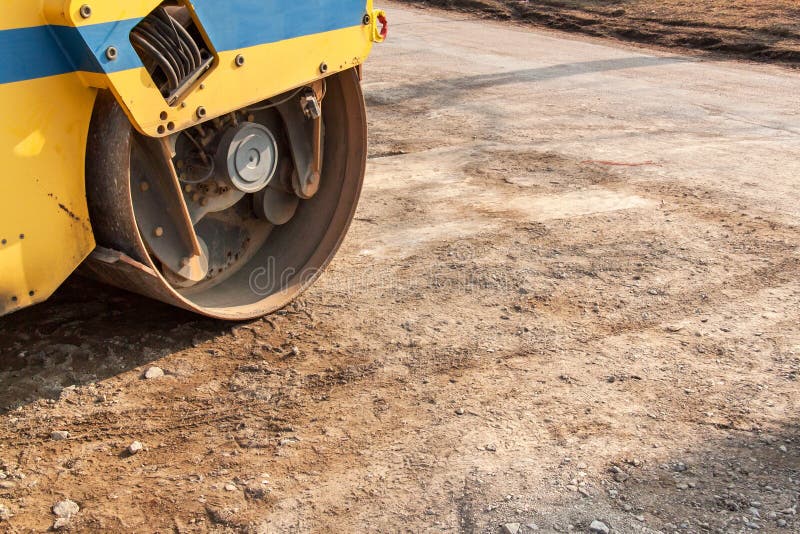 Road Roller Working at Road Construction Site. Detailed View of a Road ...