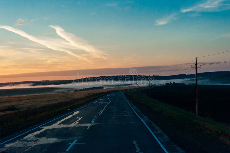 Sun Rising Above Asphalt Open Road in Sunny Sunrise Morning Stock Image ...