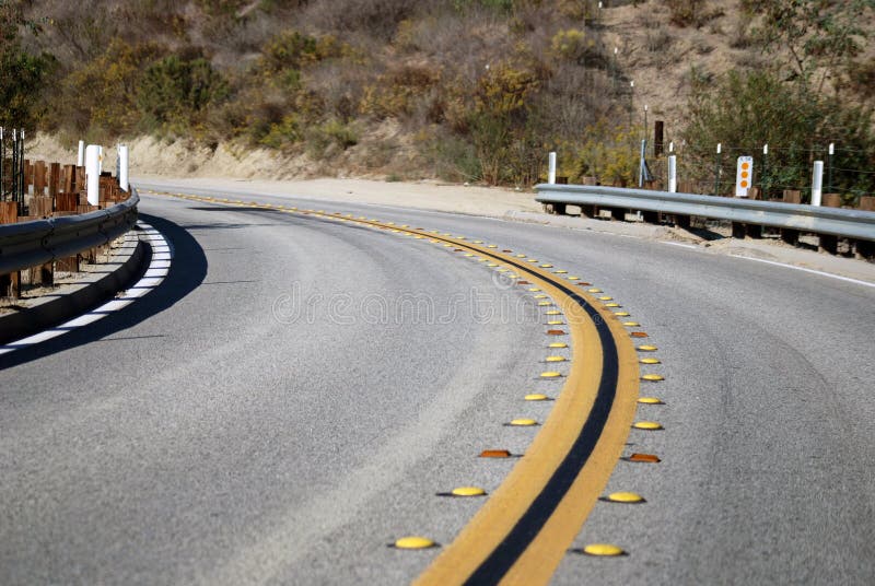 Road Sign Warning People Of Bendy Roads Ahead Stock Photo - Image of ...