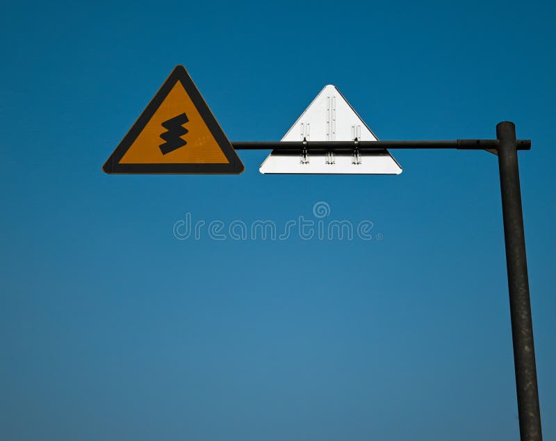 Road Safety Warning Sign on a Background of Clear Blue Sky Stock Image ...
