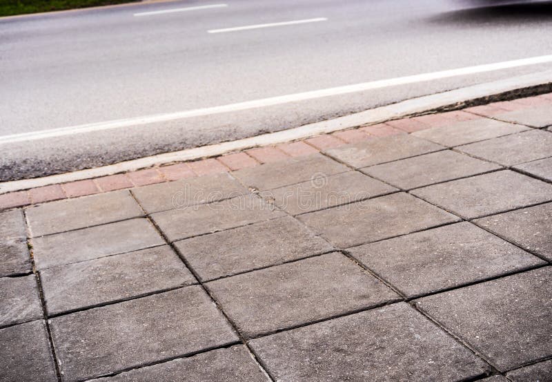 Road Side Pathway is Paved with Square Blocks of Concrete Stock Photo ...