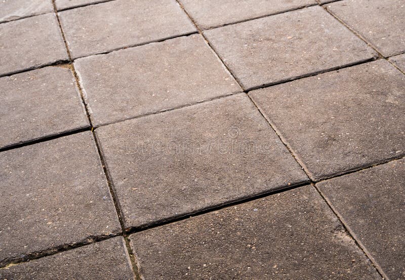 The Road Side Pathway Paved with Square Blocks of Concrete Stock Image ...