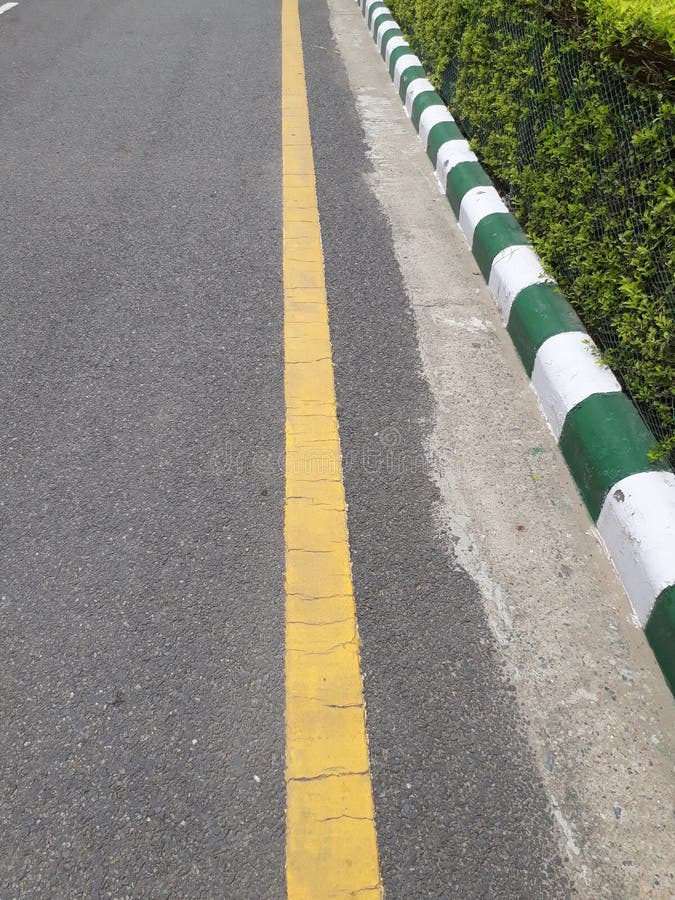 Road Side View Made Up of Fine Gray Stone and Yellow Line. Stock Photo ...