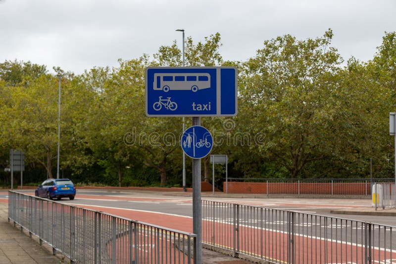 A Road Sign Along Side a Bus and Cycle Lane Stock Photo - Image of ...