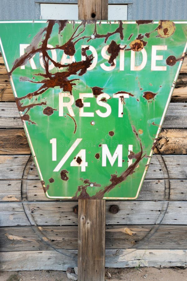 Road Sign with Bullet Holes Stock Photo - Image of straight, travel ...