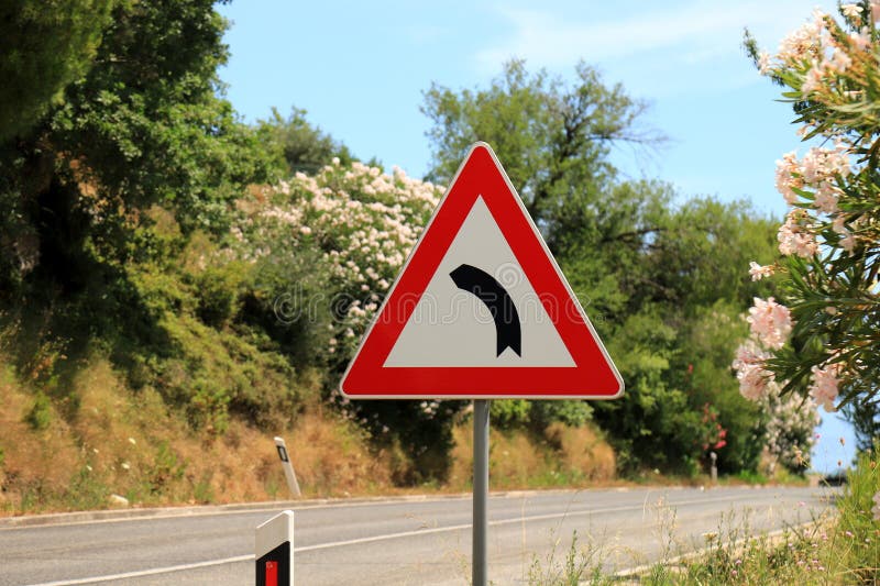 Road Sign Dangerous Left Turn on a Mountain Road in Croatia. Curving ...