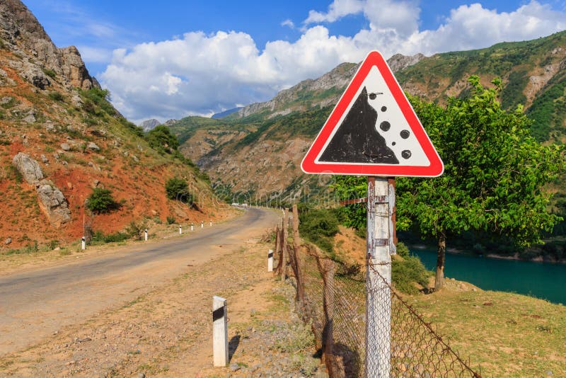 Road sign. Falling rocks stock image. Image of closeup - 63785435