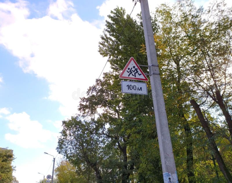 Road Sign on a High Post Near the Road Stock Image - Image of plant ...
