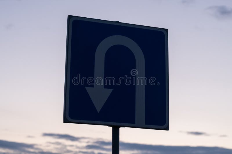 Road Sign Indicating Direction Movement in Evening Sky Stock Photo ...