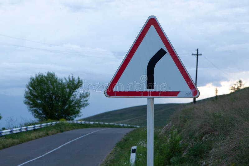 Road sign next to the road stock image. Image of icon - 219806421