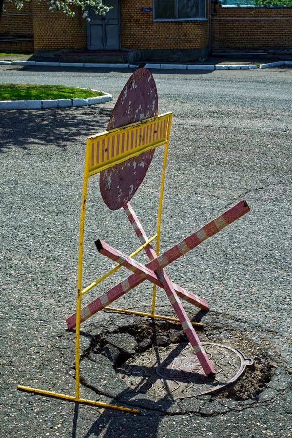 Road Sign Over a Pit on the Road Stock Photo - Image of signal, street ...