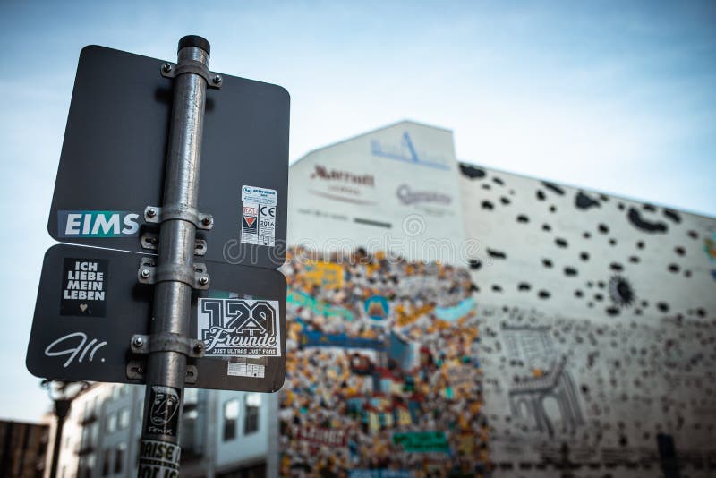 Road Sign Pasted Over with Stickers on a Graffiti Background in Leipzig ...