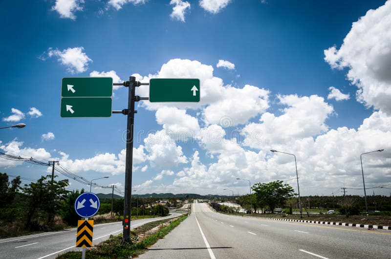 Road with Sign Pole and Blue Sky Stock Photo - Image of sign, sunlight ...