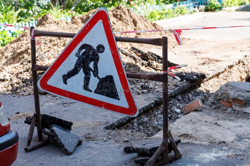 Tar Pits Sign Pointing To Leaking Tar Pit in Green Grass Stock Photo ...