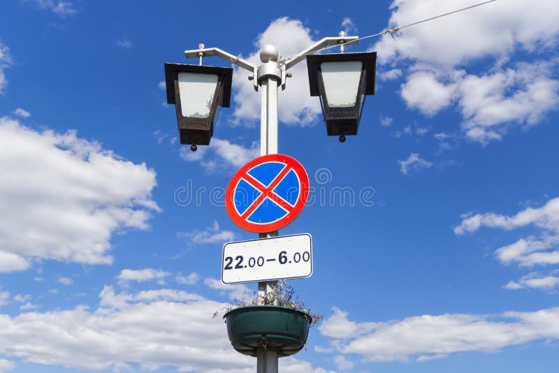 Road Sign Stop is on Lamp Post Stock Photo - Image of blue, sign: 91415794