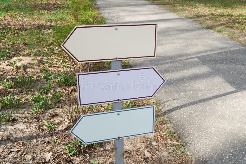 A Road Sign with Three Arrows Pointing in Different Directions Stock ...