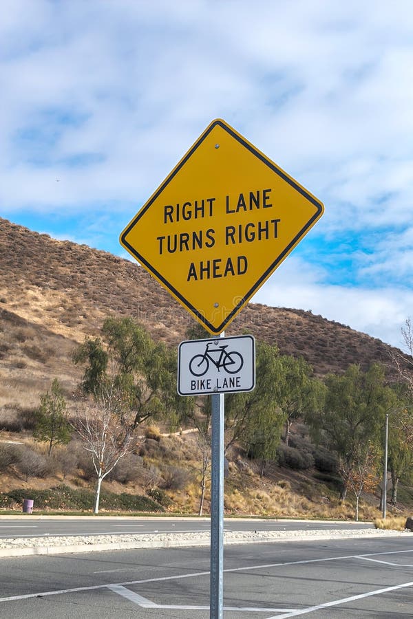 Road Sign Warning that Right Lane Turns Right Ahead Stock Image - Image ...